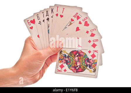 Cards in hand isolated on black Stock Photo - Alamy