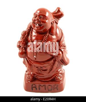 Buddha little statue with red background Stock Photo - Alamy