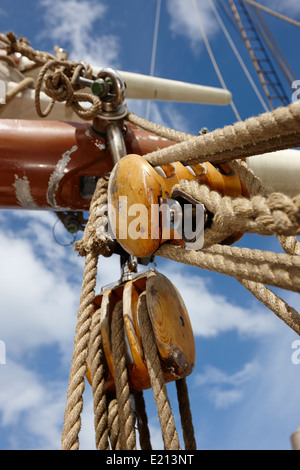 Tall Ship Rigging. Block and Tackle pulleys with ropes next to the mast ...