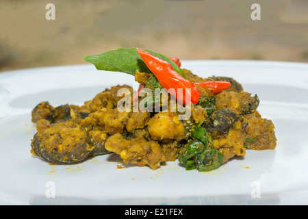 Stir spicy fried bengal monitor on dish Stock Photo - Alamy