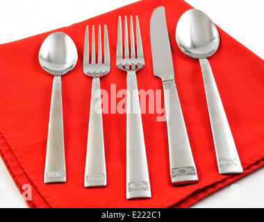 Elegant spoon with napkin isolated on white Stock Photo - Alamy