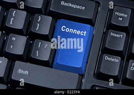 A keyboard with a blue button Connect Stock Photo - Alamy