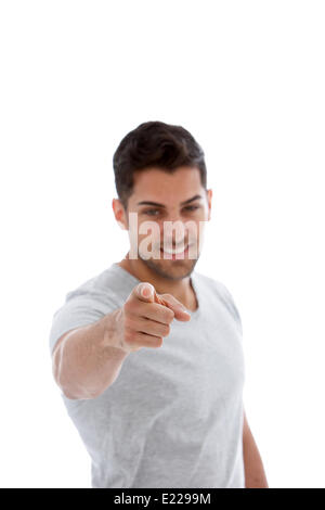 Handsome young man pointing at you, isolated over white background ...