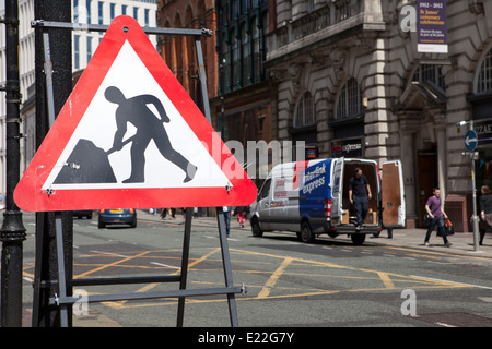 uk road sign roadworks ahead man digging Stock Photo: 30847832 - Alamy