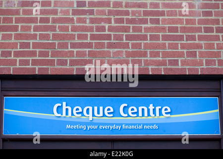 Blue cheque cashing sign Stock Photo - Alamy
