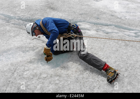 A mountain guide demonstrates making a prusik knot and how to set up a ...