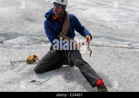 A mountain guide demonstrates making a prusik knot and how to set up a ...
