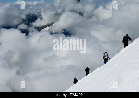 Climbers on the superb airy traverse of the Breithorn in the Swiss Alps ...