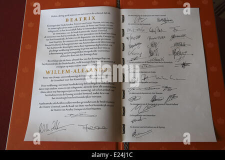 Queen Beatrix signs the Act of Abdication in favour of her son, Prince ...