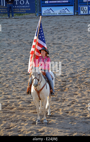 Cowgirl Carrying American Flag Riding Palomino Horse and Cowboy ...
