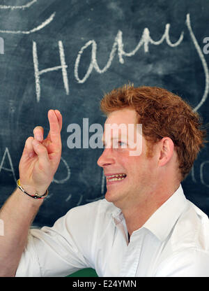 Prince Harry tries his hand at sign sign language in a class at the ...