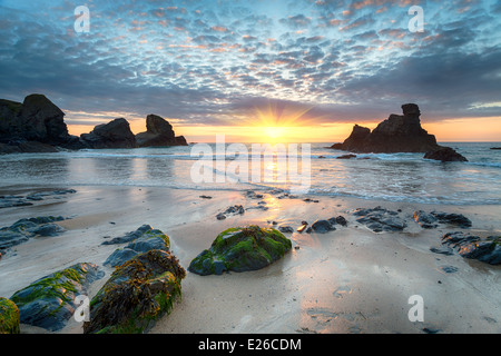 Sunset at Porthcothan Bay, a sandy cove on the north coast of Cornwall ...