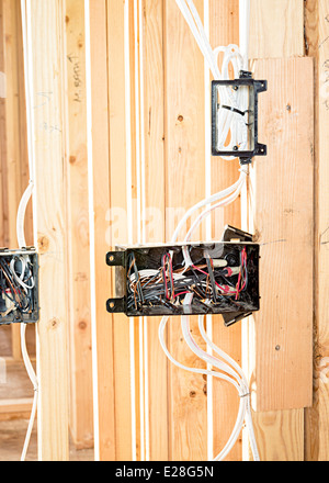 Studs and electrical in new home construction Stock Photo - Alamy