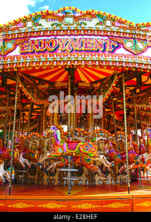 Old fashioned carousel fun fair ride Stock Photo - Alamy