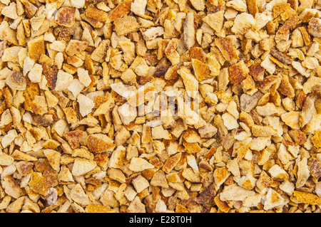 Bowl of dried orange zest seasoning, fresh peel and anise on white ...