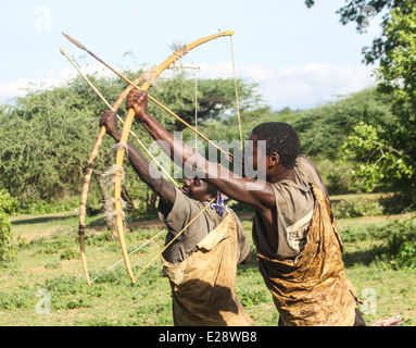 Hadza man hunting with bow and arrow Lake Eyasi Tanzania Small tribe ...