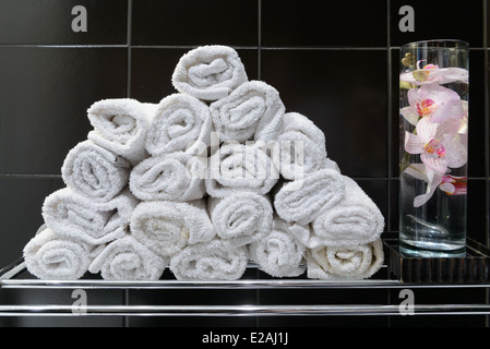 Stack of rolled hand towels in public bathroom Stock Photo - Alamy