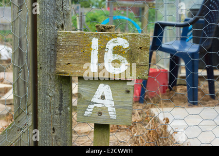 Wooden sign giving garden plot number Stock Photo - Alamy
