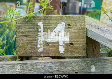 Wooden sign giving garden plot number Stock Photo - Alamy