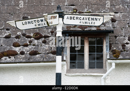 Traditional old-fashioned signpost direction sign pointing to ...