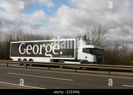 GEORGE at ASDA supermarket clothing lorry, traveling on the M6 Motorway ...