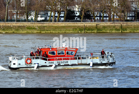 London Fire Brigade Fire and Rescue Boat on the River Thames with The ...