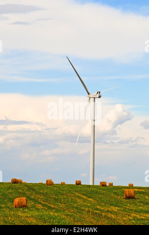 Wind turbines farm and straw bales after harvest Stock Photo - Alamy