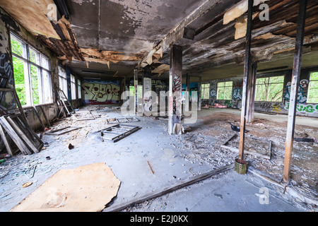 Messy burnt and abandoned industrial warehouse factory room Stock Photo ...