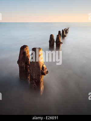 Groynes and surf at Sandsend near Whitby in North Yorkshire, England ...