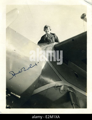 This historic image features Amelia Earhart's plane flying over the ...