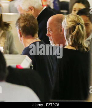 Billy Joel and his wife Alexis Roderick passes through airport security ...