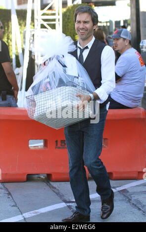 Eric McCormack holding a gift bag of electronic goodies Featuring: Eric ...