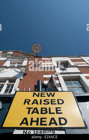 british road sign stating new raised table ahead Stock Photo - Alamy