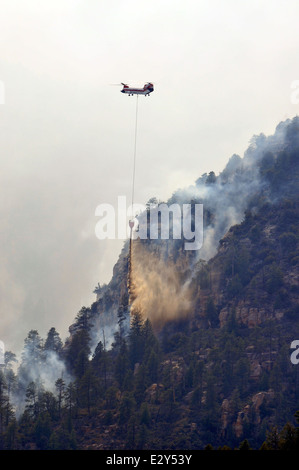 A helicopter drop during the Slide Fire in Oak Creek Canyon ...