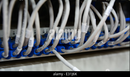 close-up of mess pattern ethernet cables connected to computer internet ...