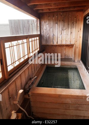 Traditional Japanese indoor onsen hot spring complete with furo-isu ...