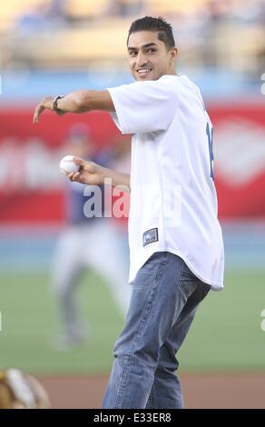 Boxer Josesito Lopez throws the first pitch before the game between San ...