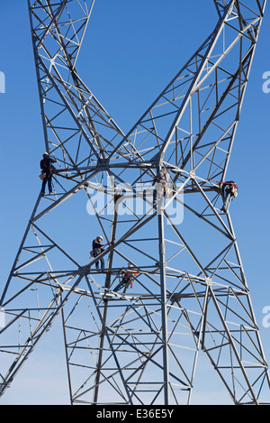 Construction crew assembling electricity transmission tower in Utah ...