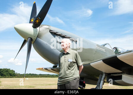 WW2 veteran pilot standing by a Spitfire Stock Photo - Alamy