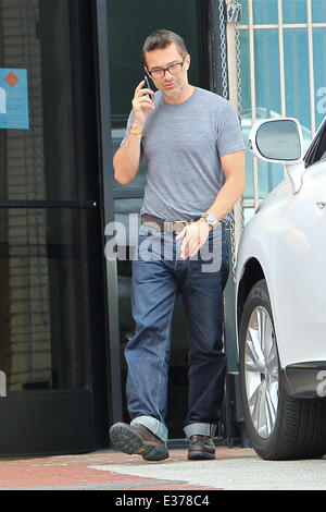 Olivier Martinez seen on his cell phone as he returns to his car ...