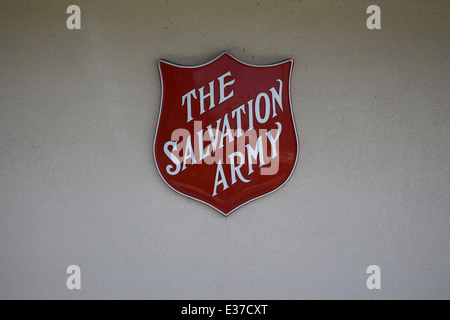 The Red Shield logo of the Salvation Army on the brick wall of a church ...