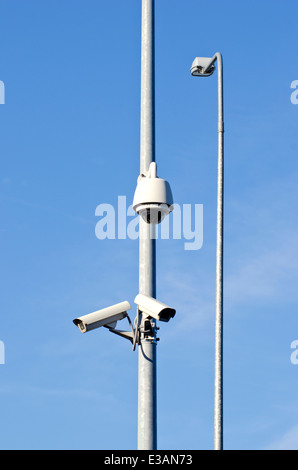 Security camera on a lamp post Stock Photo - Alamy