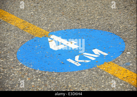 A distance marker sign painted on a cycle path in London, Ontario Stock ...