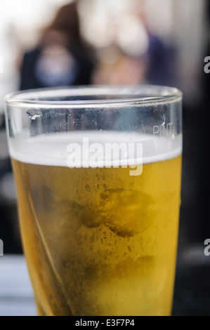 Pint of cider on pub table Stock Photo - Alamy