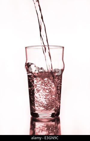 glass with water pouring with shadow Stock Photo - Alamy