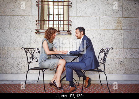 Full table view, people hands and eating process. Friends at the table ...