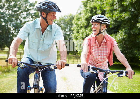 Middle Aged Couple Enjoying Country Cycle Ride Together Stock Photo - Alamy