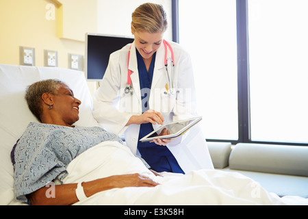 A woman in a white coat talks on a phone Stock Photo - Alamy