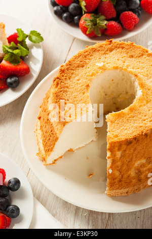 Homemade cake with fresh berries and sweet desserts on dark background ...