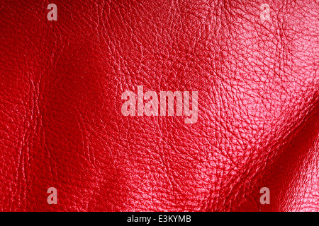 Texture of folds vivid red skin leather background Stock Photo - Alamy